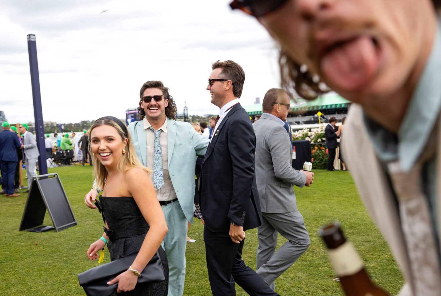 Kicking On - Wet Melbourne Cup racegoers fire up
